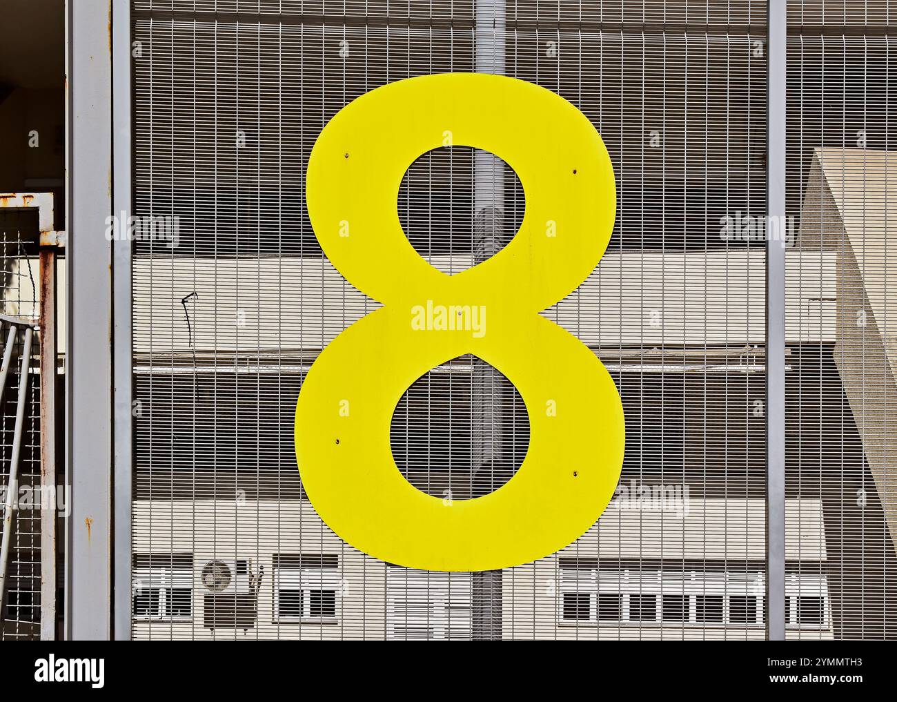 Number eight in metal on metallic grid Stock Photo - Alamy