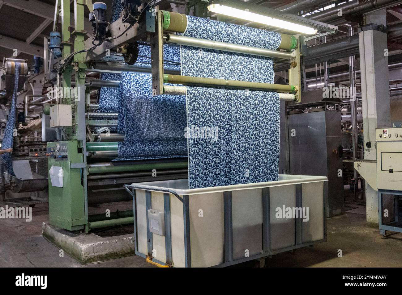 Fabric machine industrial plant line in a textile factory Stock Photo ...