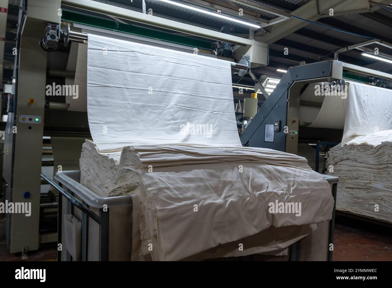 Fabric machine industrial plant line in a textile factory Stock Photo ...