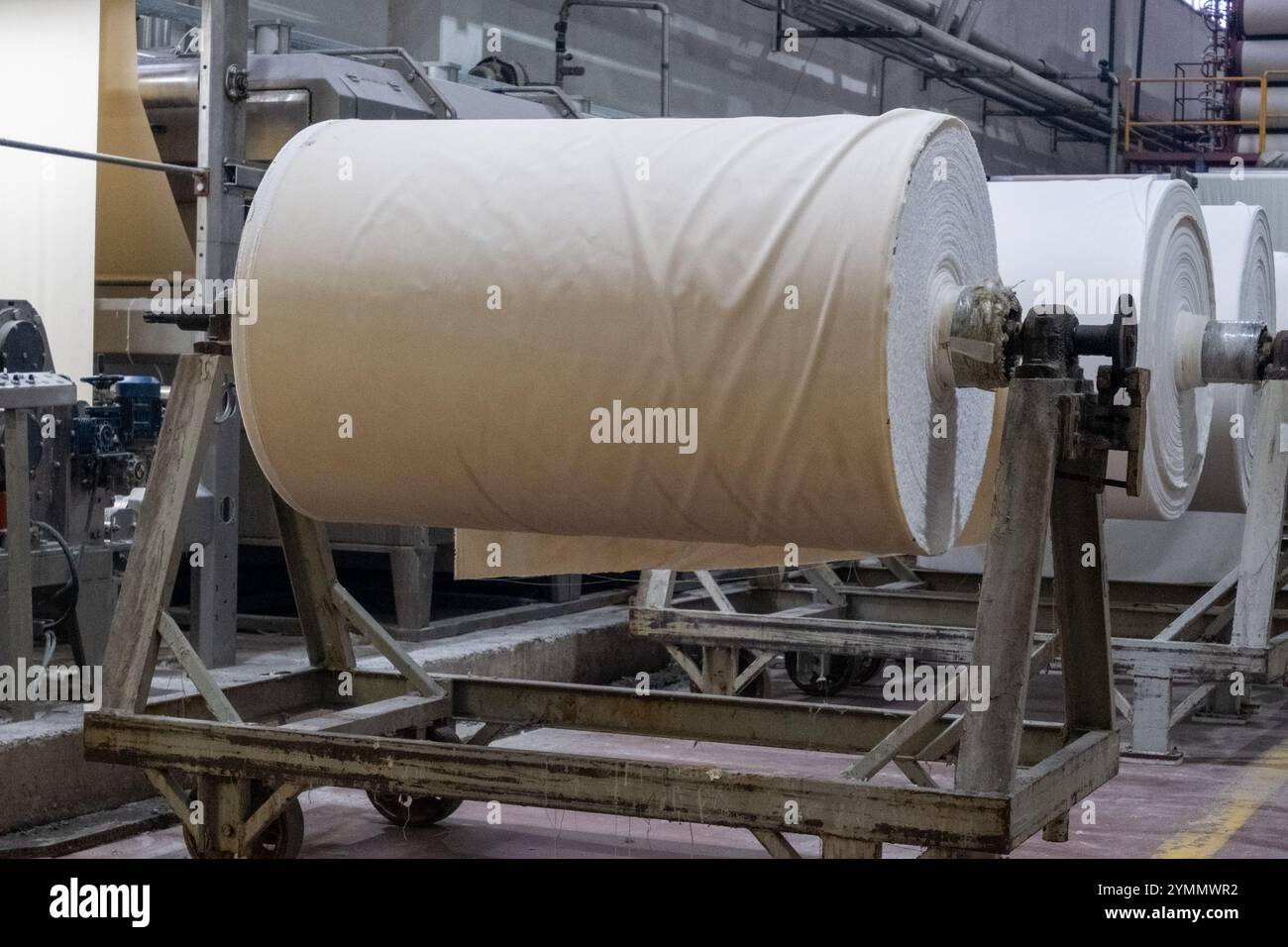 Fabric machine industrial plant line in a textile factory Stock Photo ...