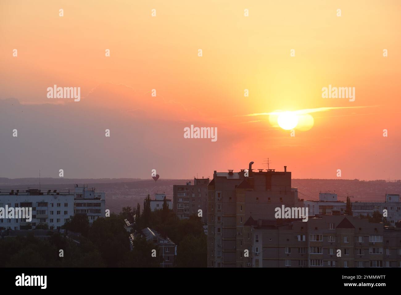 Sunset view over city buildings with clear skies Stock Photo - Alamy