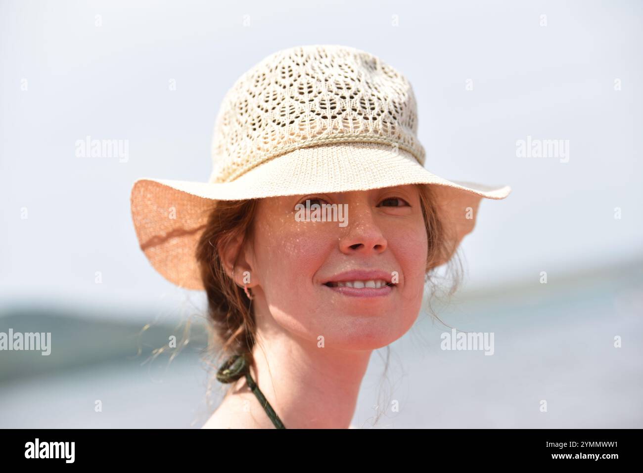 Woman enjoys sunny beach day hi-res stock photography and images - Alamy