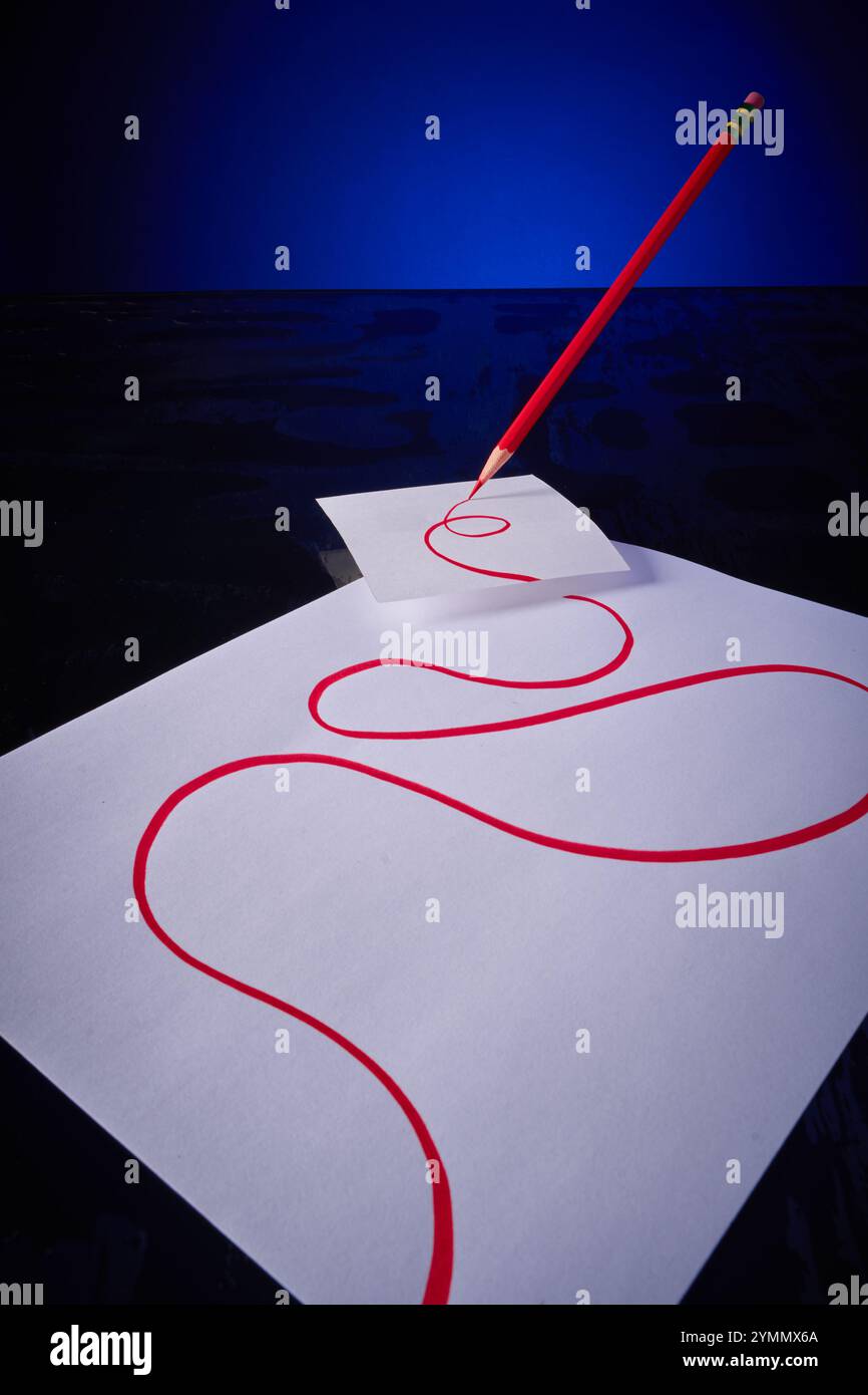 Red pencil drawing a swirling line Stock Photo - Alamy