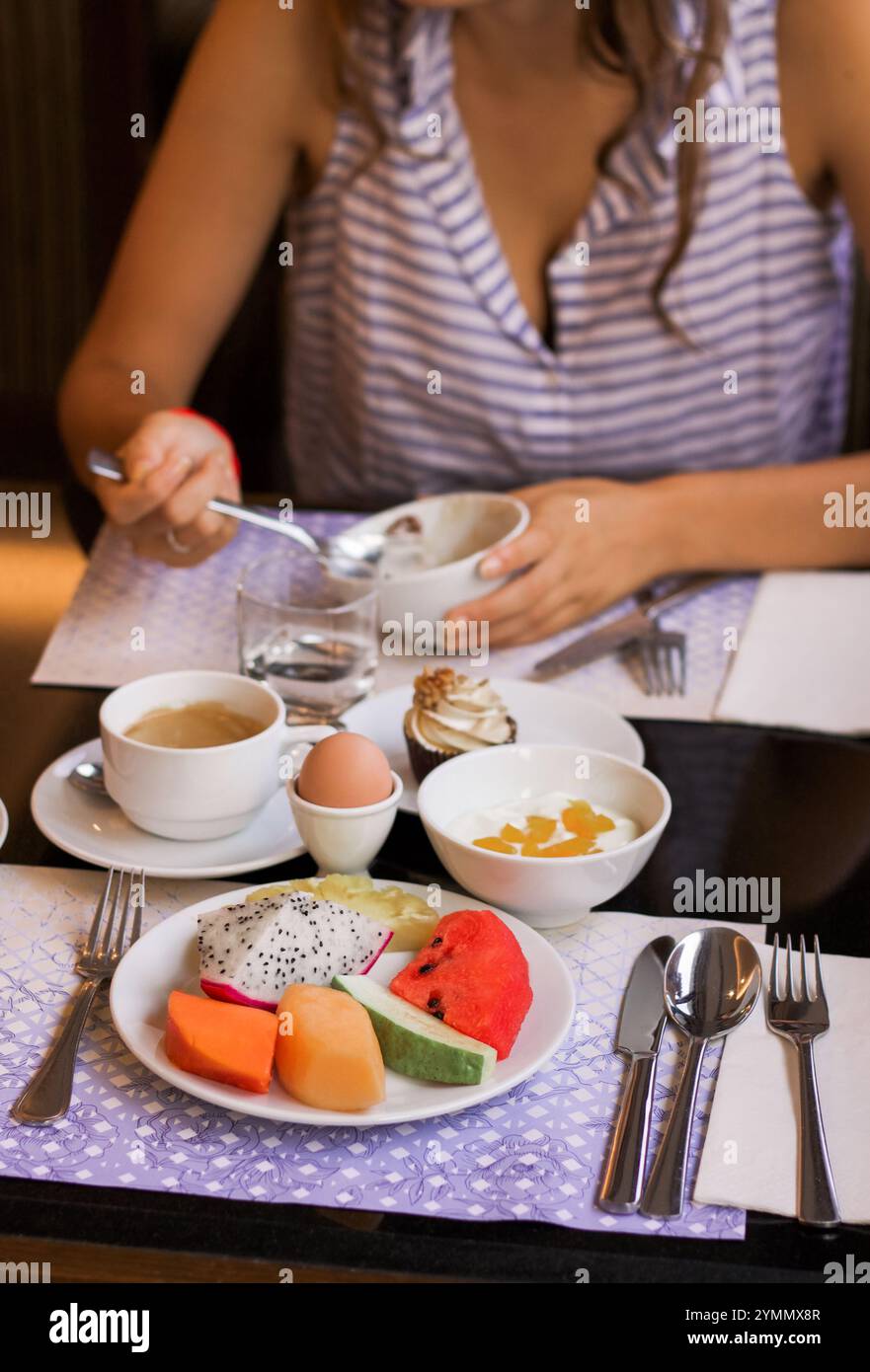 healthy breackfast for two with exotic fruits egg yogurt and coffee ...