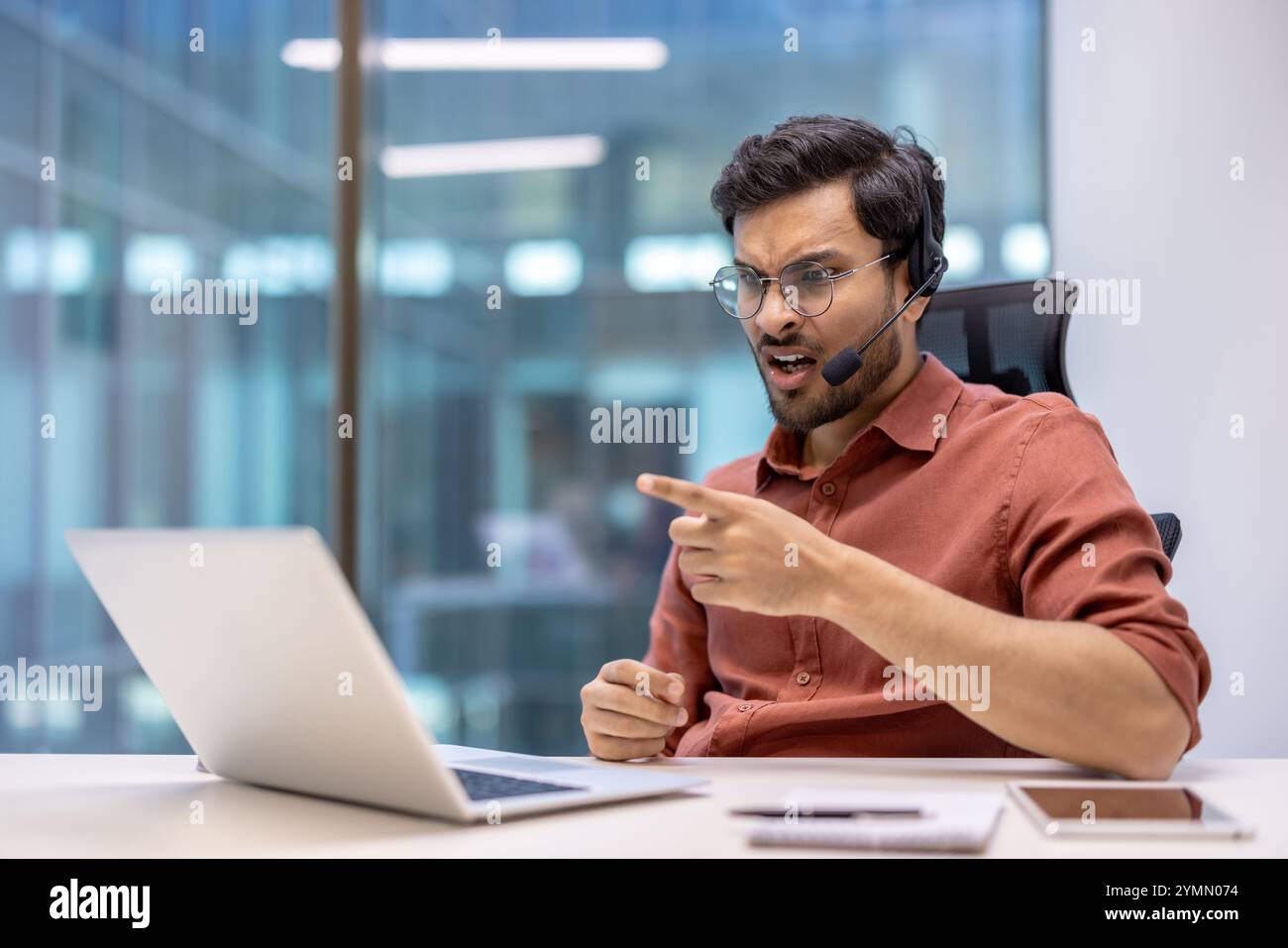 Latin American man businessman engaging in video call using laptop and ...