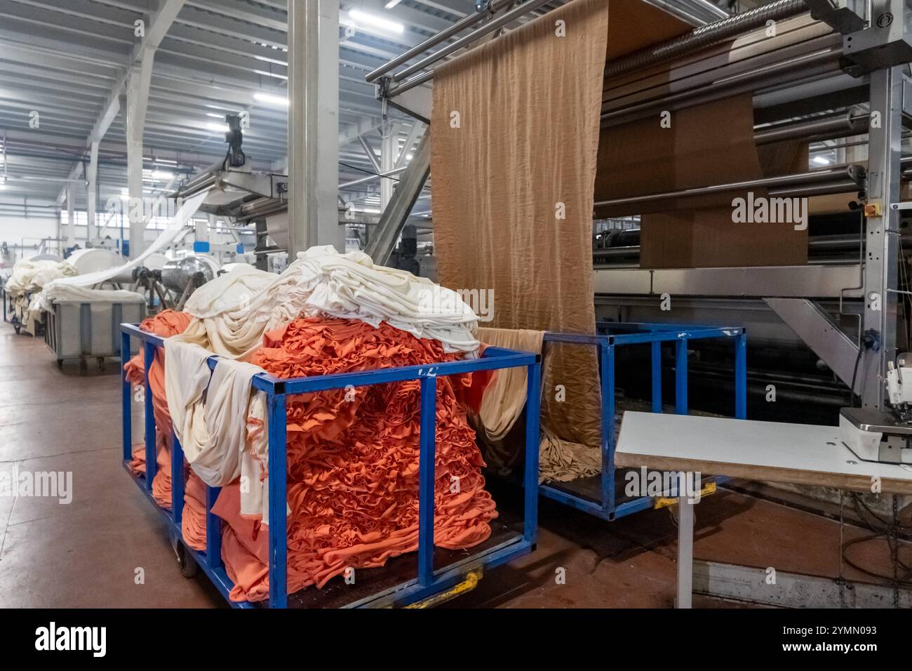 Fabric machine industrial plant line in a textile factory Stock Photo ...