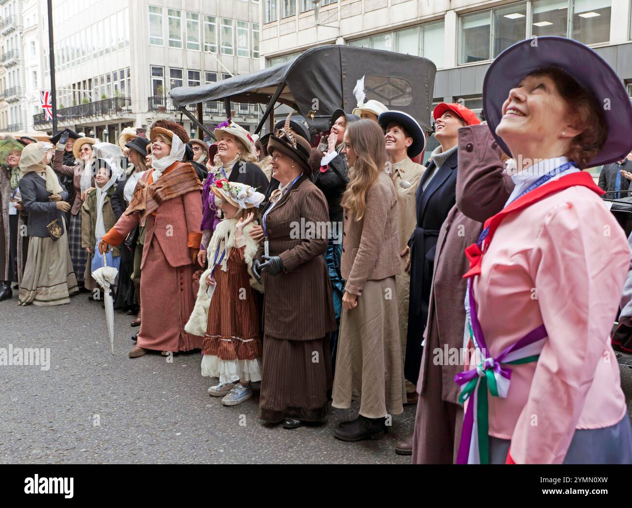 Ladies in period dress pose outside the RAC, in Pall Mall, as part of ...