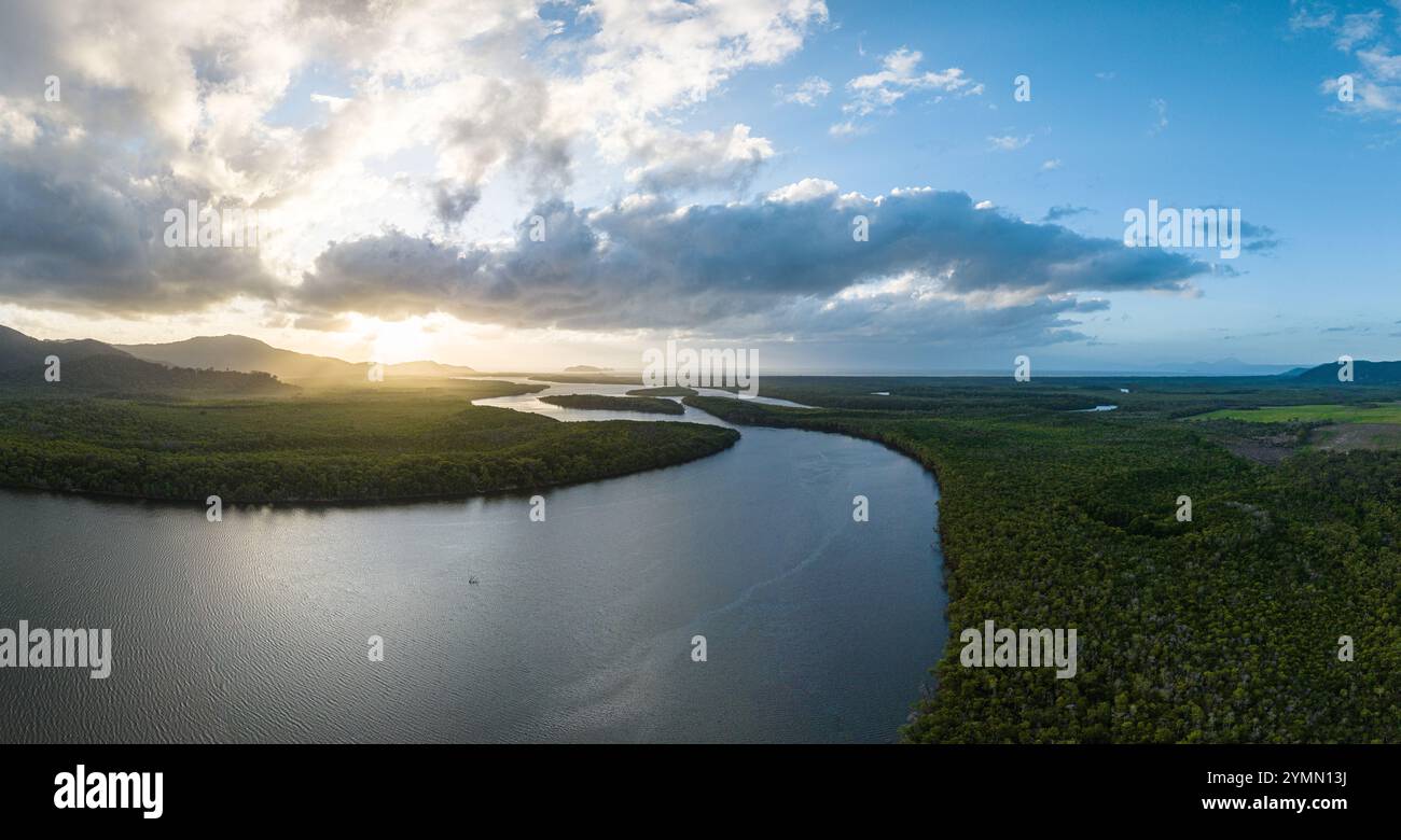 Sunrise over a meandering river mouth. Located in the Daintree River ...