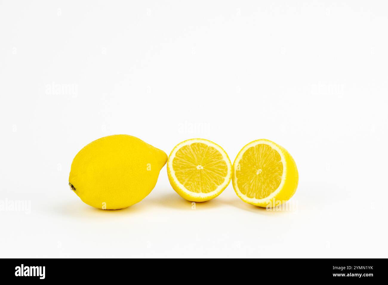 texture of lemon pulp cut in half and whole lemon on white Stock Photo ...