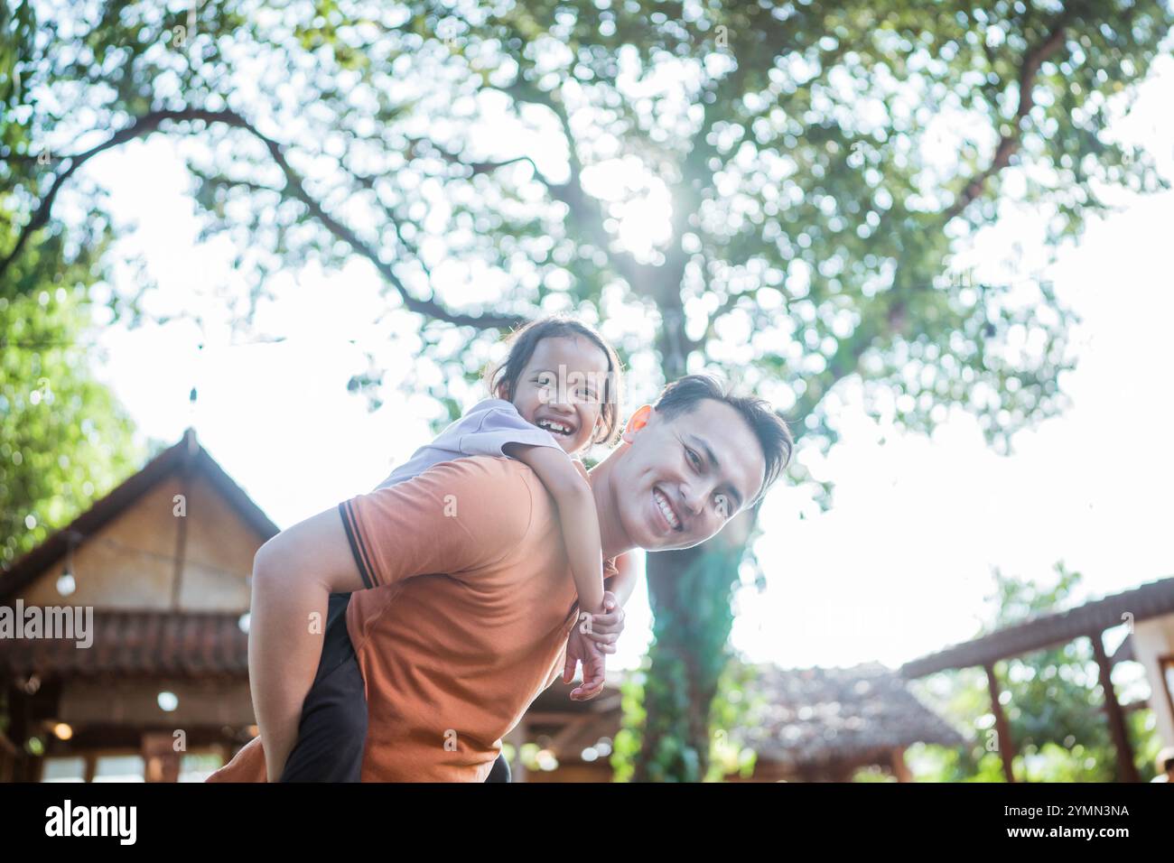 happy asian father piggyback young daughter Stock Photo - Alamy