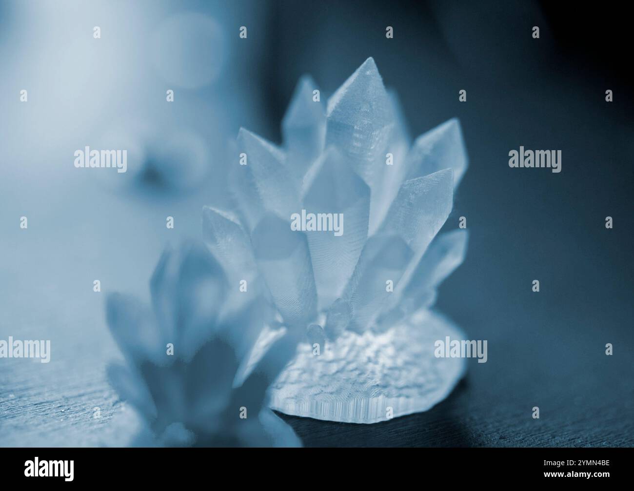 Detailed models in the form of crystals printed on 3D printer from polymer close-up. Detailed ...