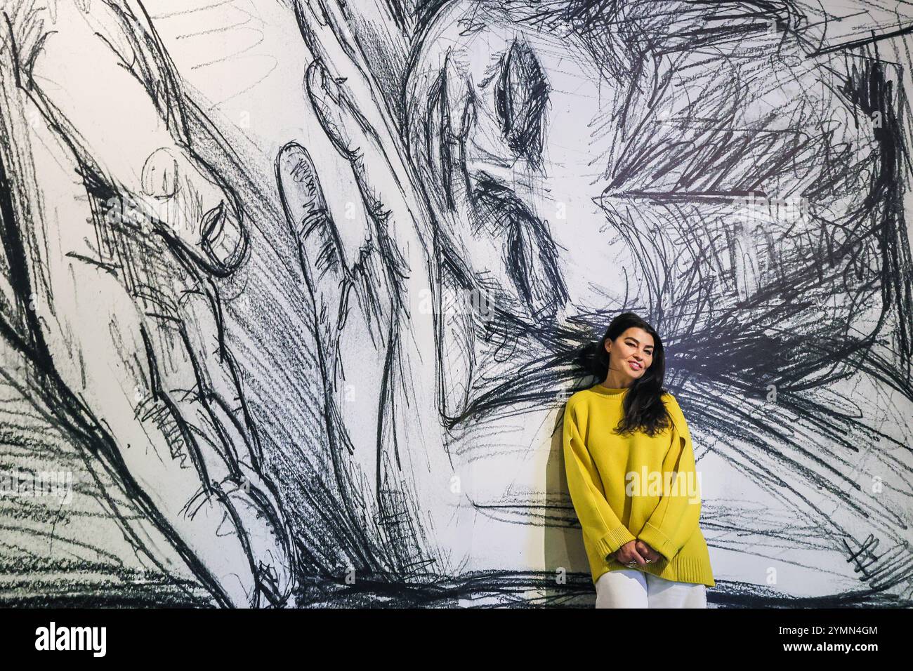 London, UK, 22nd Nov 2024. The artist with one of the drawings, which ...