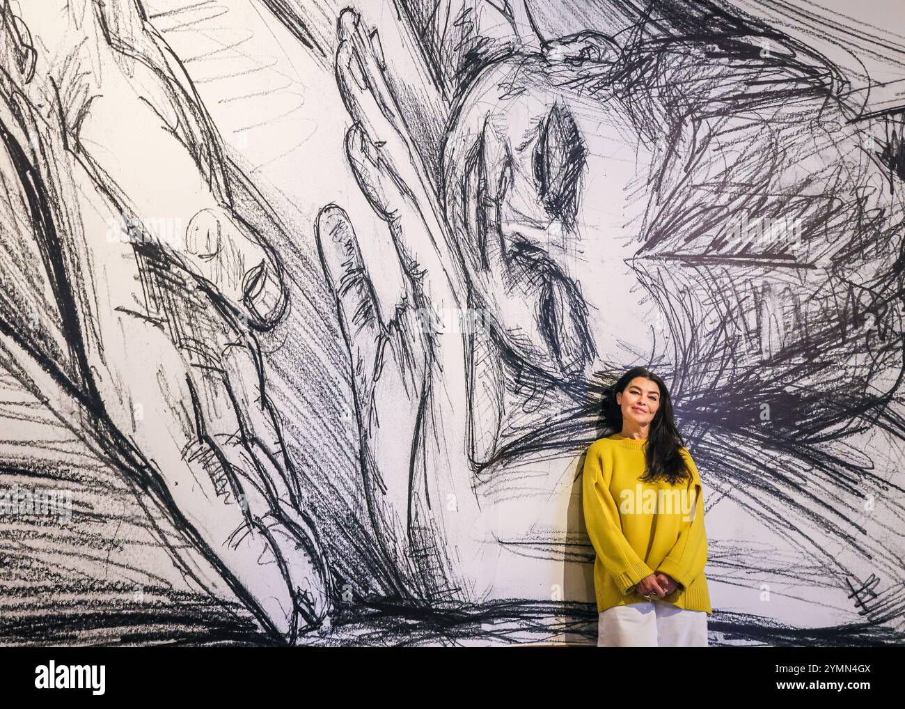 London, UK, 22nd Nov 2024. The artist with one of the drawings, which ...
