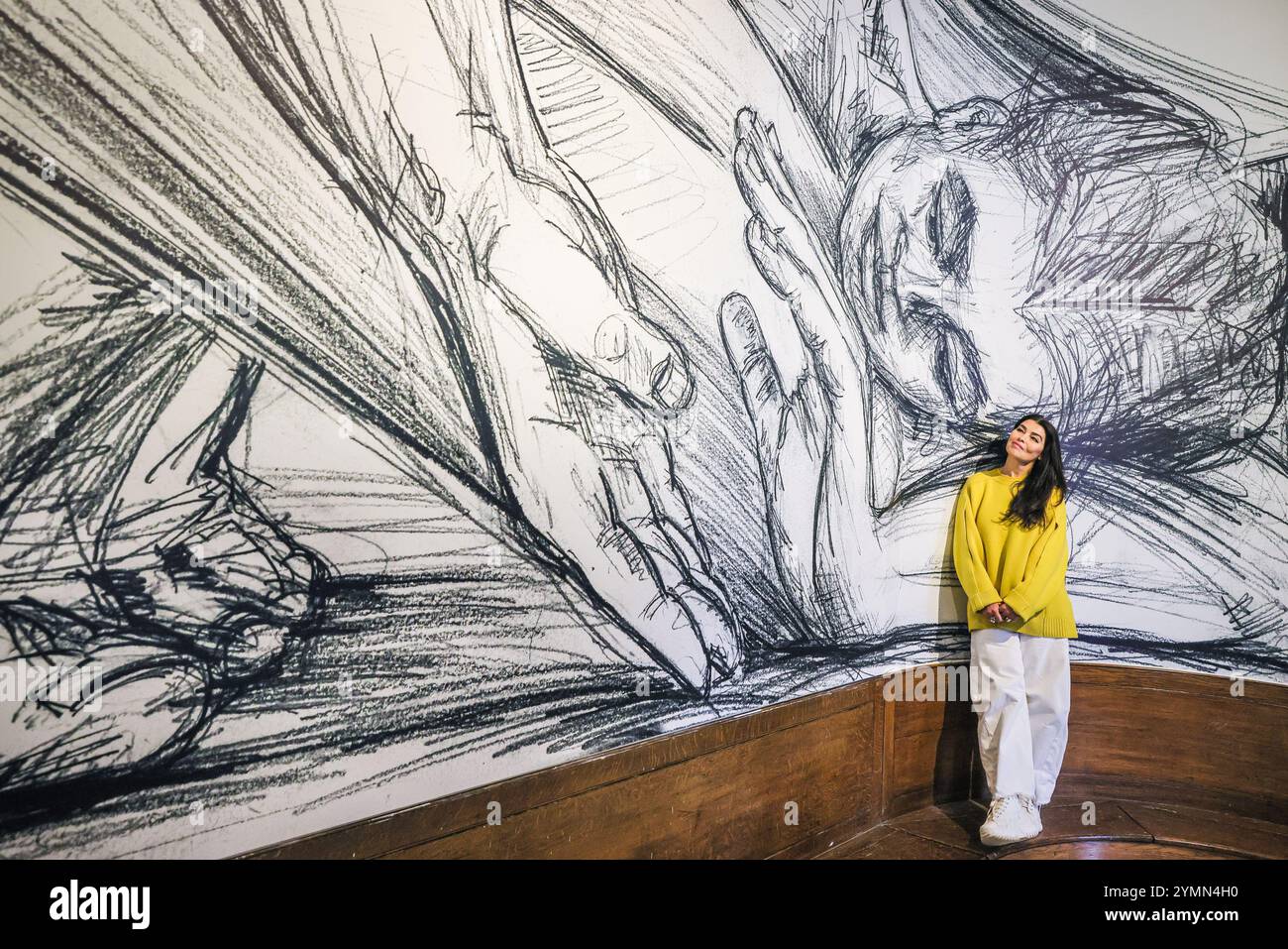 London, UK, 22nd Nov 2024. The artist with one of the drawings, which ...