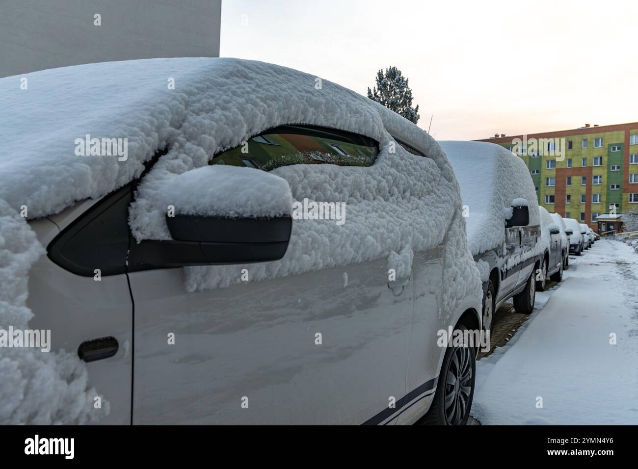 Preparing the car to go to work, clearing snow from the car, removing ...