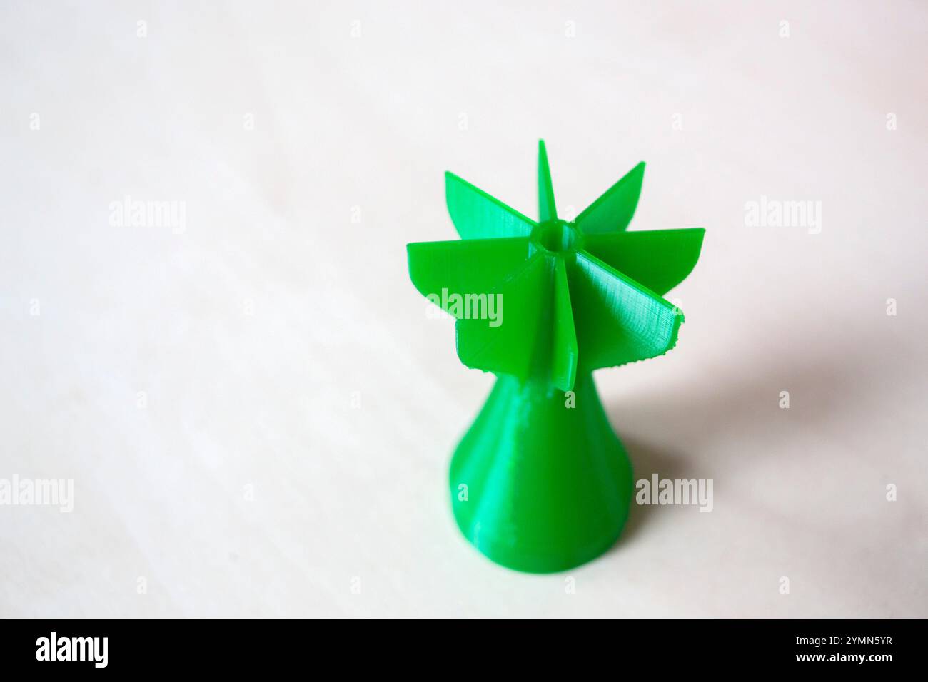 Prototype model of rocket bomb tip printed on 3D printer. Small colored ...