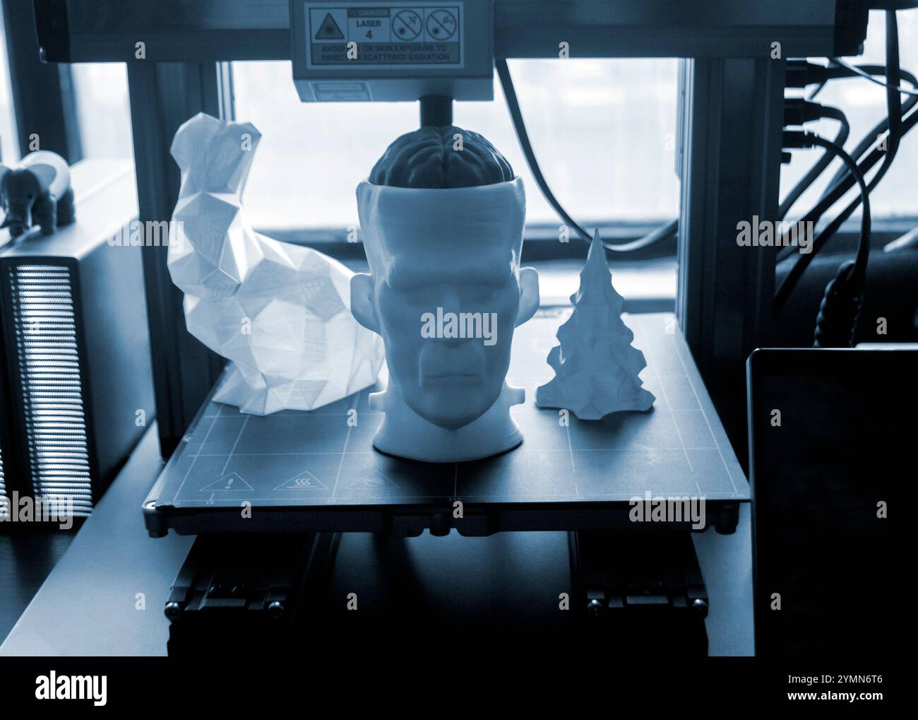 Art models printed on 3D printer on desktop of 3D printer. Models of ...