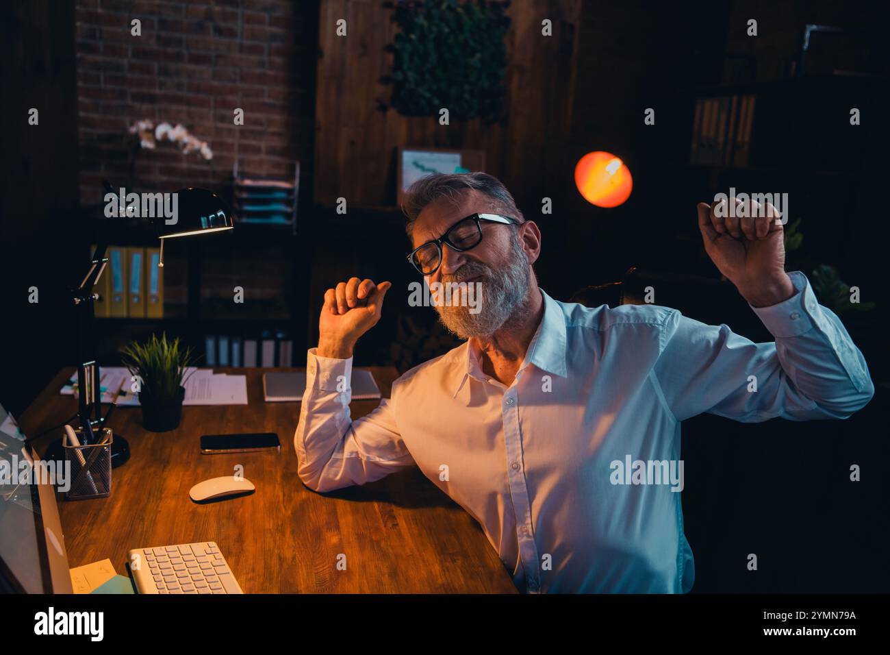 Photo of handsome mature man tired sleepy stretching wear white shirt ...