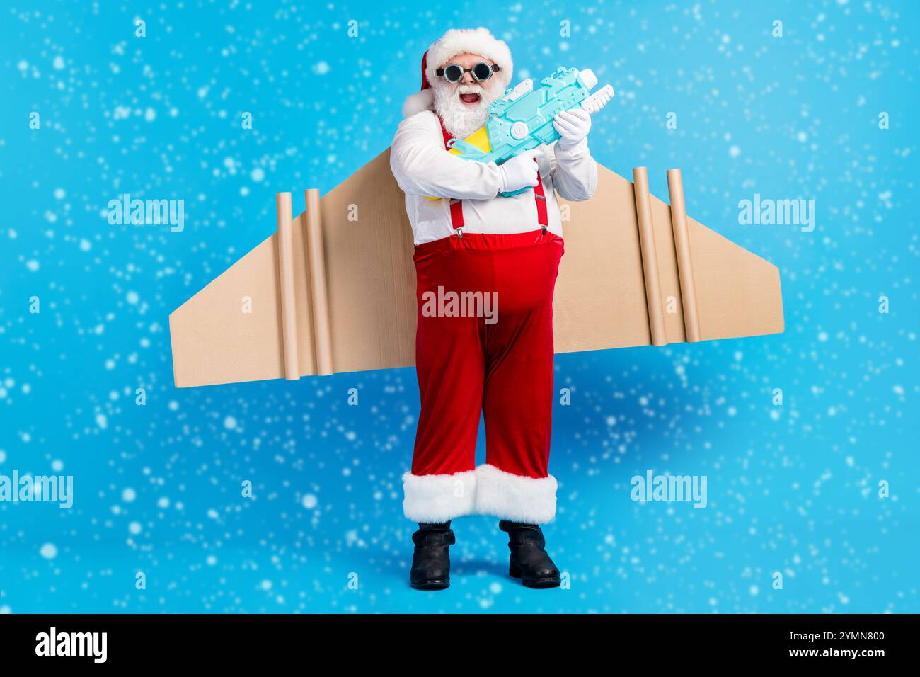 Full length photo of white grey hair bearded santa claus play water gun ...