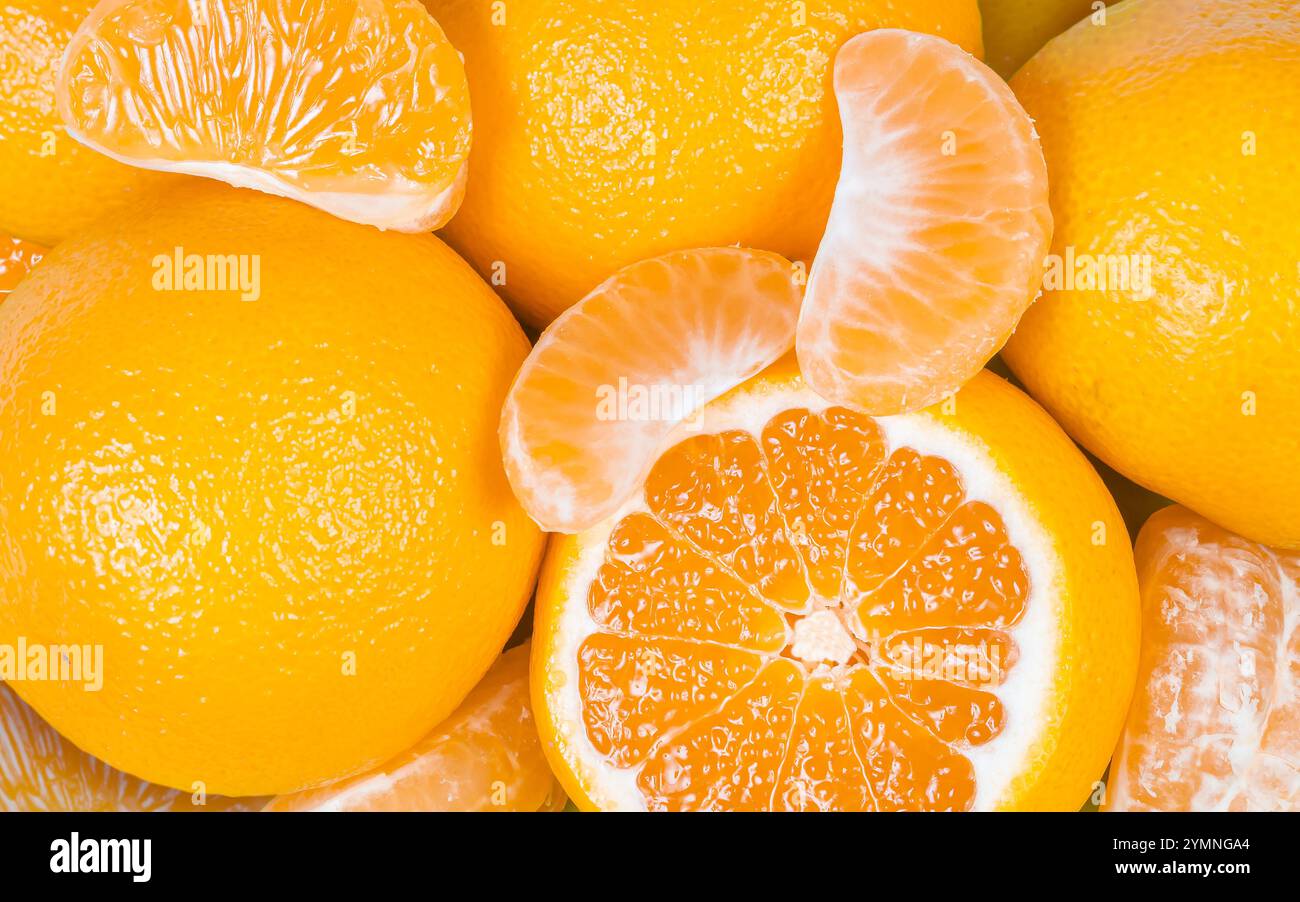 Bright yellow citrus fruits are arranged attractively, showcasing their ...