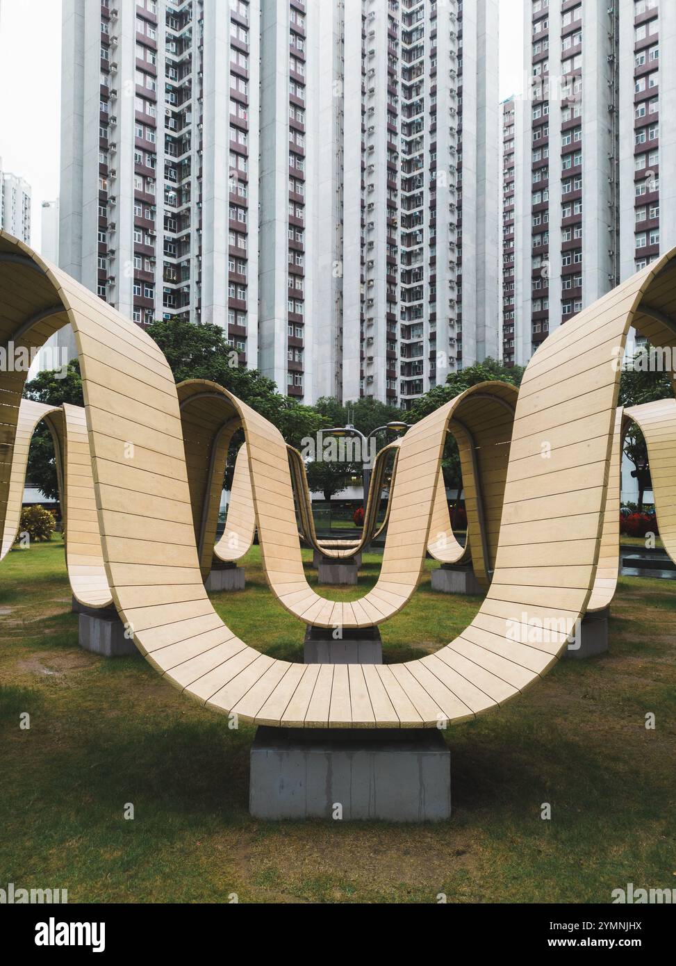 Contemporary Wooden Wave Bench Installation in Urban Green Space with ...