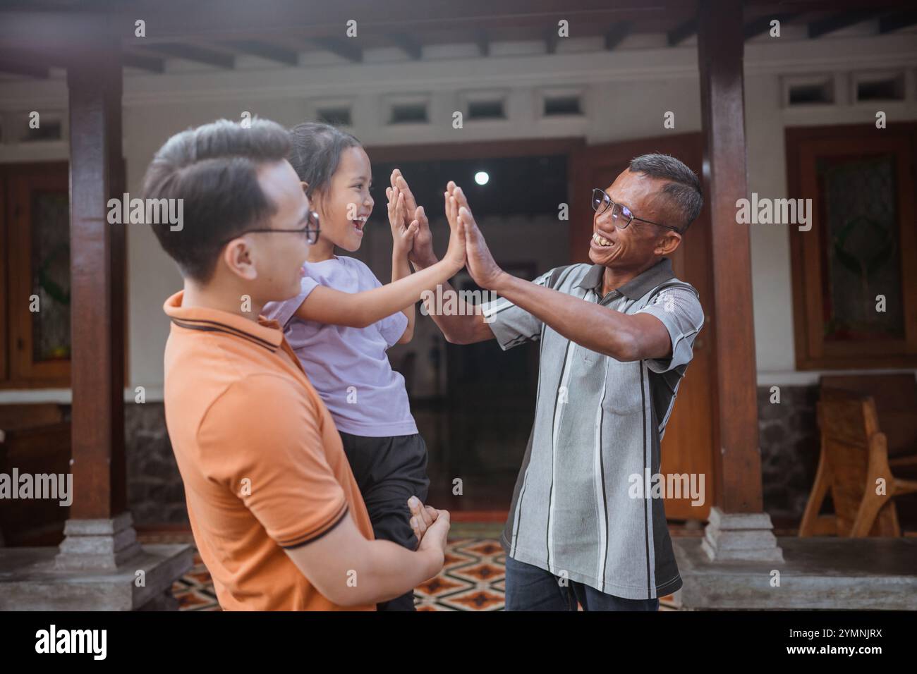 three generation family high five hand Stock Photo - Alamy
