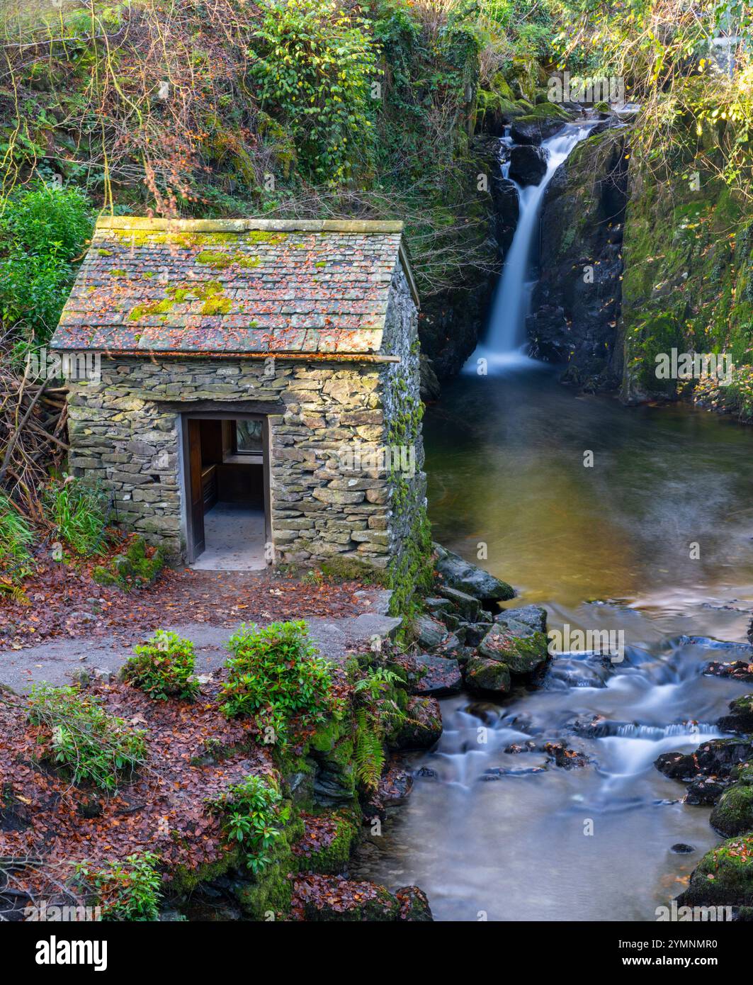 A river flowing over Rydal Falls in the Lake District National Park ...