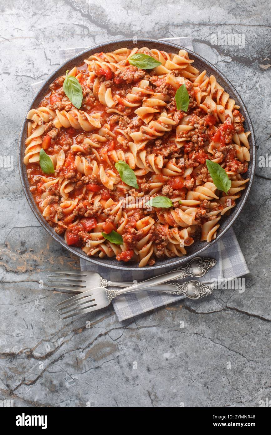 Italian Big Fusilloni bolognese pasta with a beef tomato sauce closeup ...