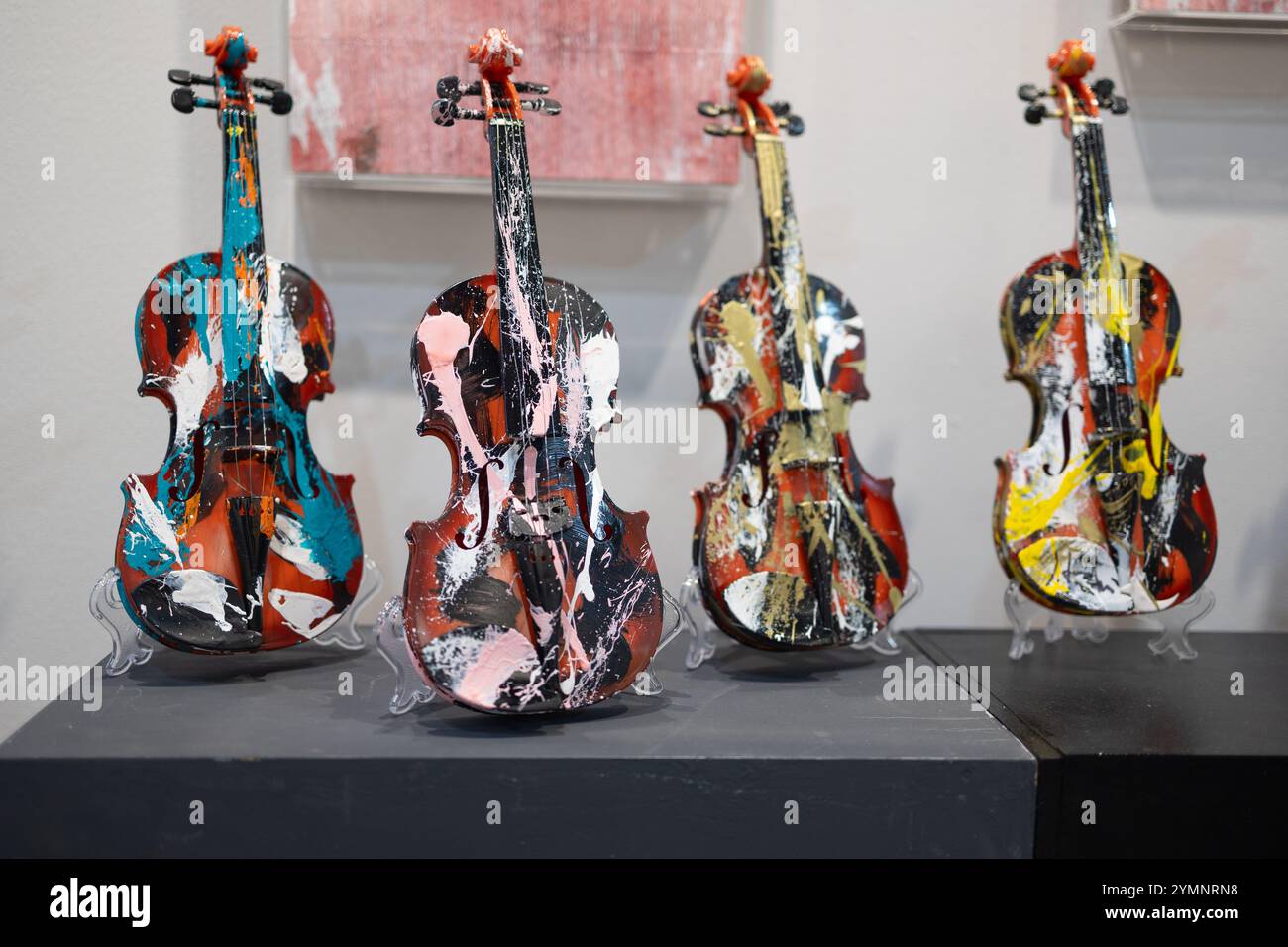 Hand-Painted Colorful Violins in a Modern Art Installation Stock Photo ...