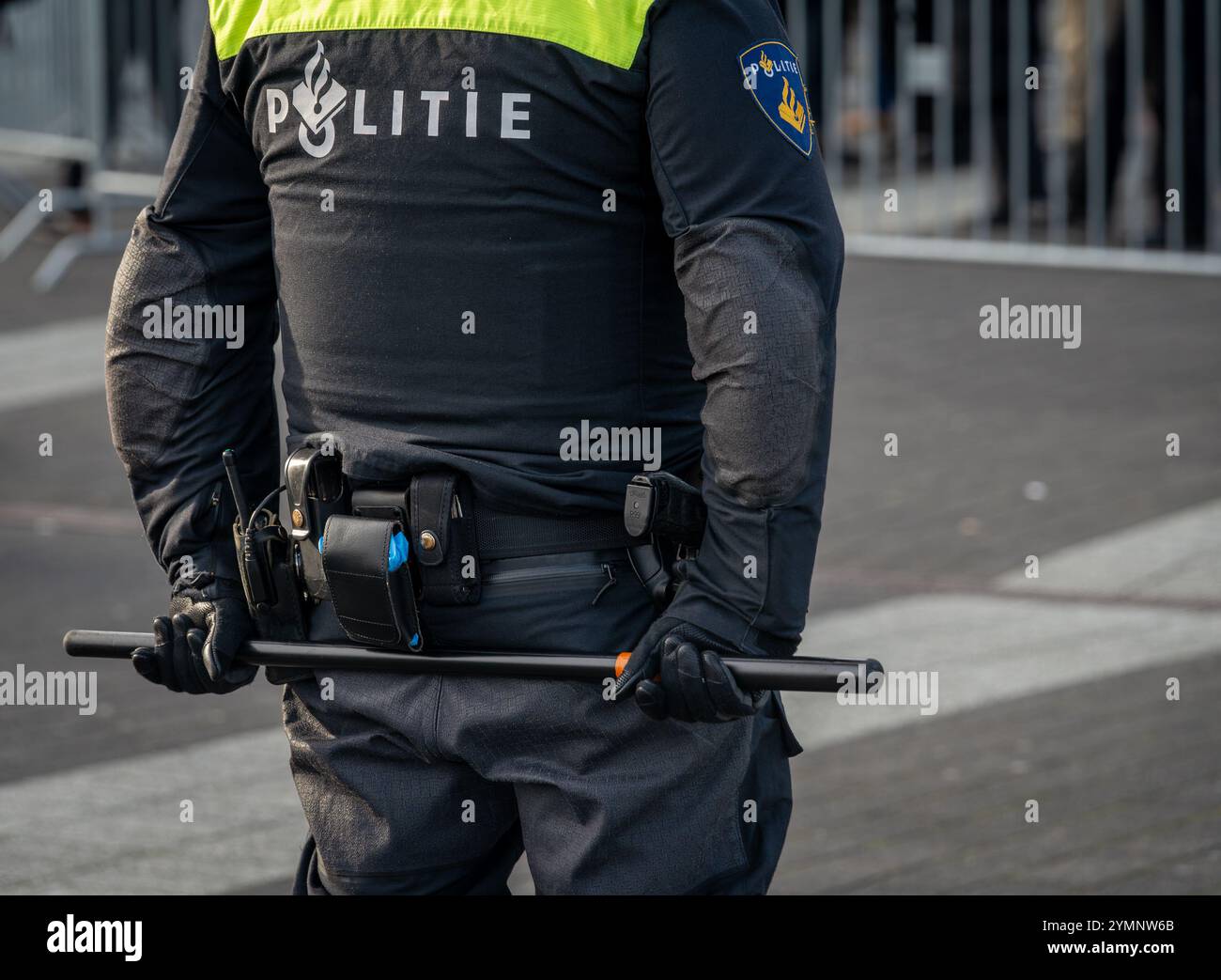 Rotterdam, The Netherlands, 21.11.2024, Dutch Police Officer Holding a ...
