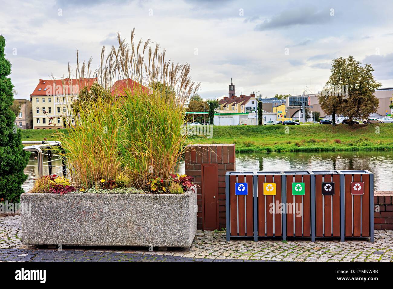 Stylish containers for waste segregation on the city pier. Caring for ...