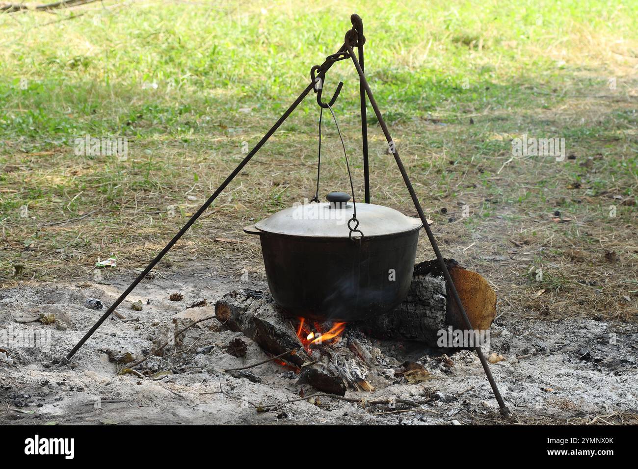 Old pot cooking over campfire hi-res stock photography and images - Alamy