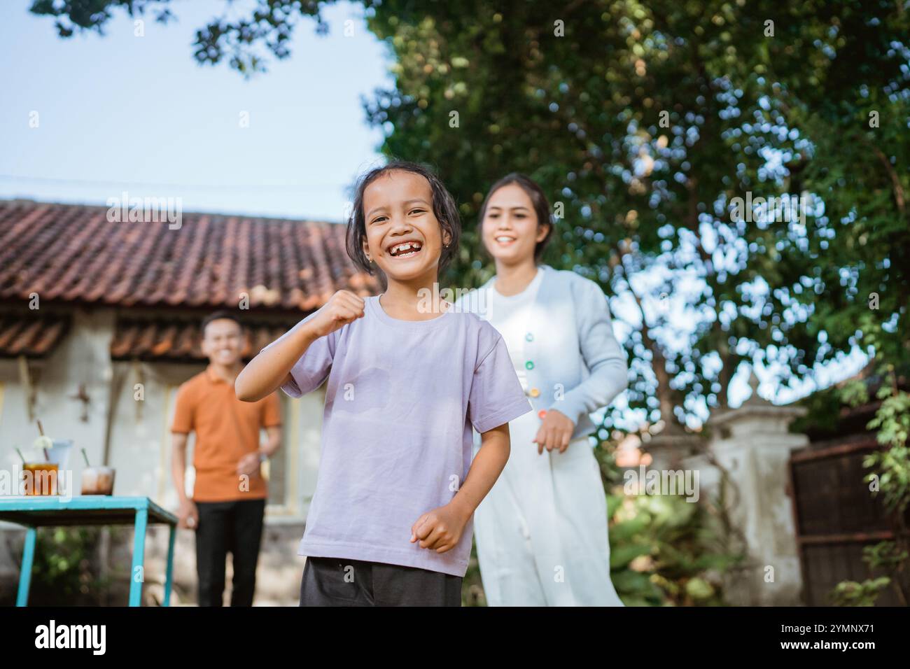 cheerful kid girl with fist hand gesture Stock Photo - Alamy