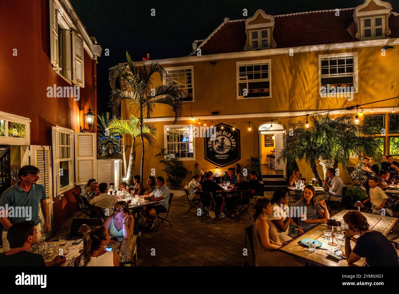 Dinner in the shared courtyard of the Gouverneur de Rouville restaurant and the Swinging Old ...