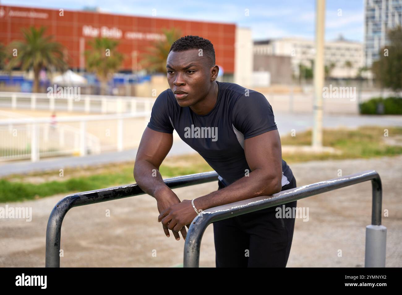 Strong black man resting after calisthenics workout outdoors Stock ...