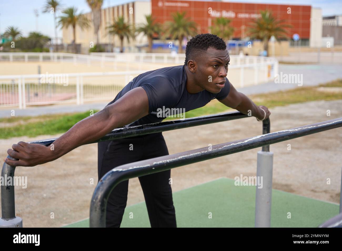 Young black man doing calisthenics in an outdoor gym Stock Photo - Alamy