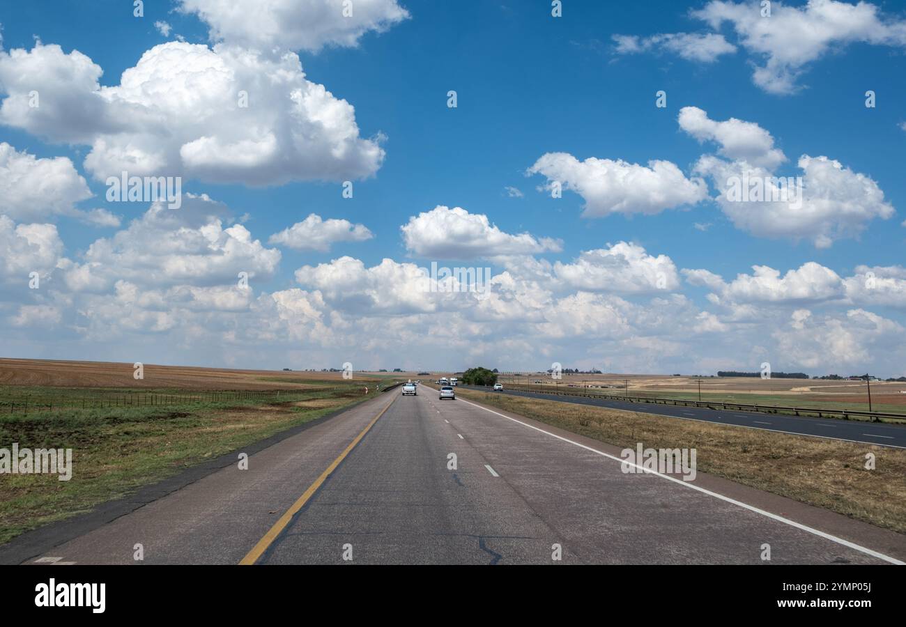 Highway in South African countryside. Asphalt road stretches straight ...
