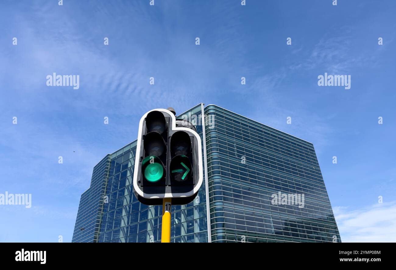 Green traffic light and green arrow, blue sky background, Go straight ...