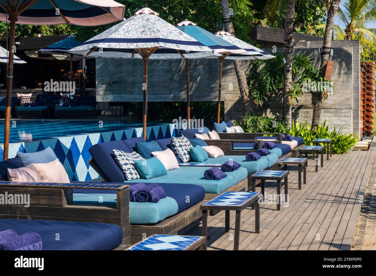 Blue deck chairs and parasols at Manarai Beach House, Sofitel, Nusa Dua ...
