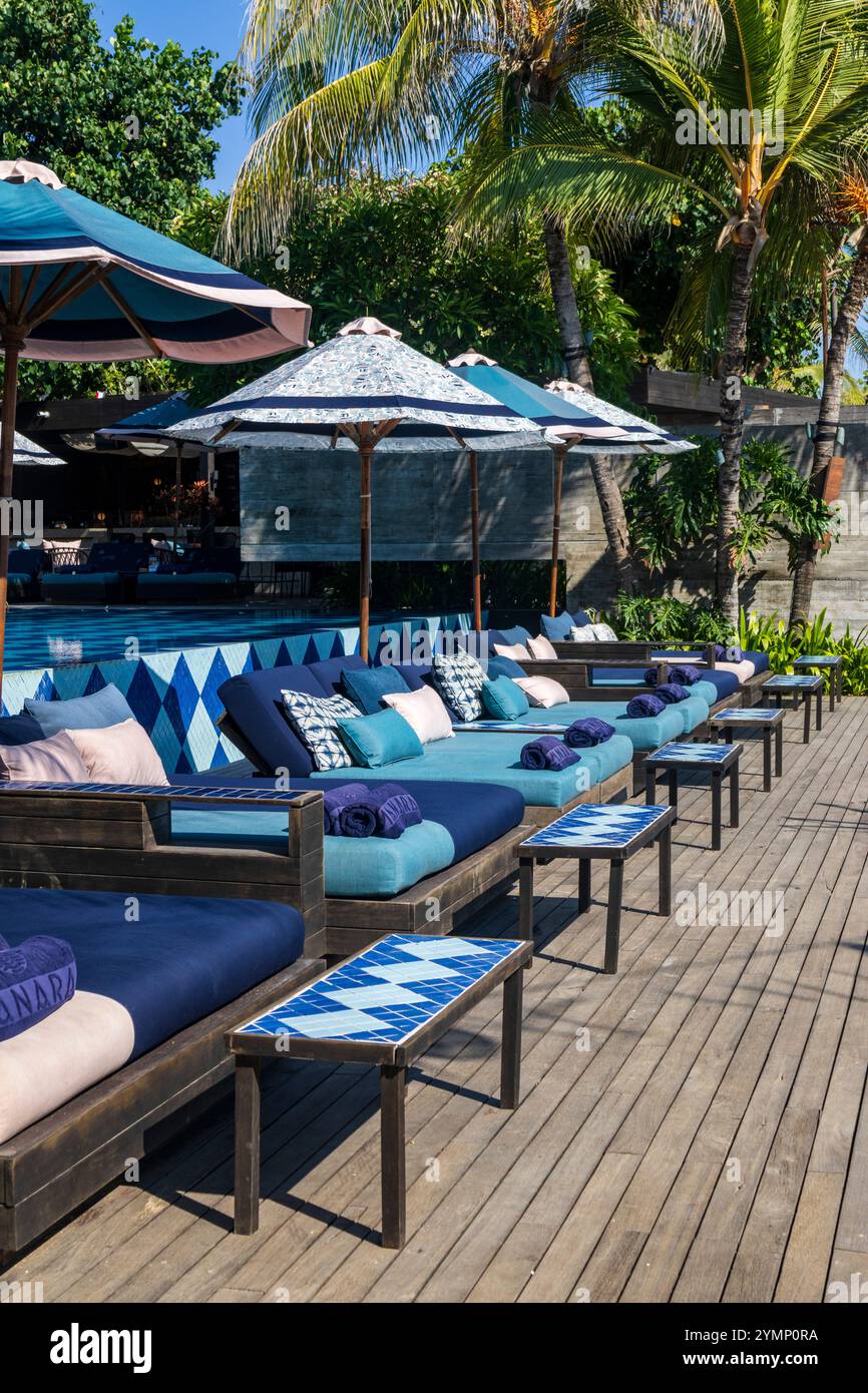 Blue deck chairs and parasols at Manarai Beach House, Sofitel, Nusa Dua ...