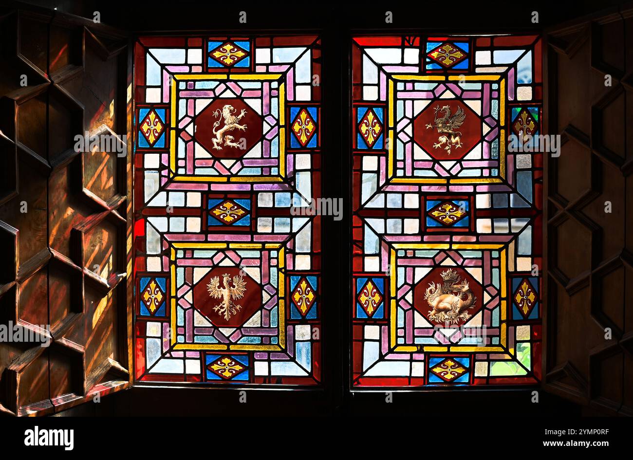 A stunning stained glass window in a Spanish castle, where vibrant ...