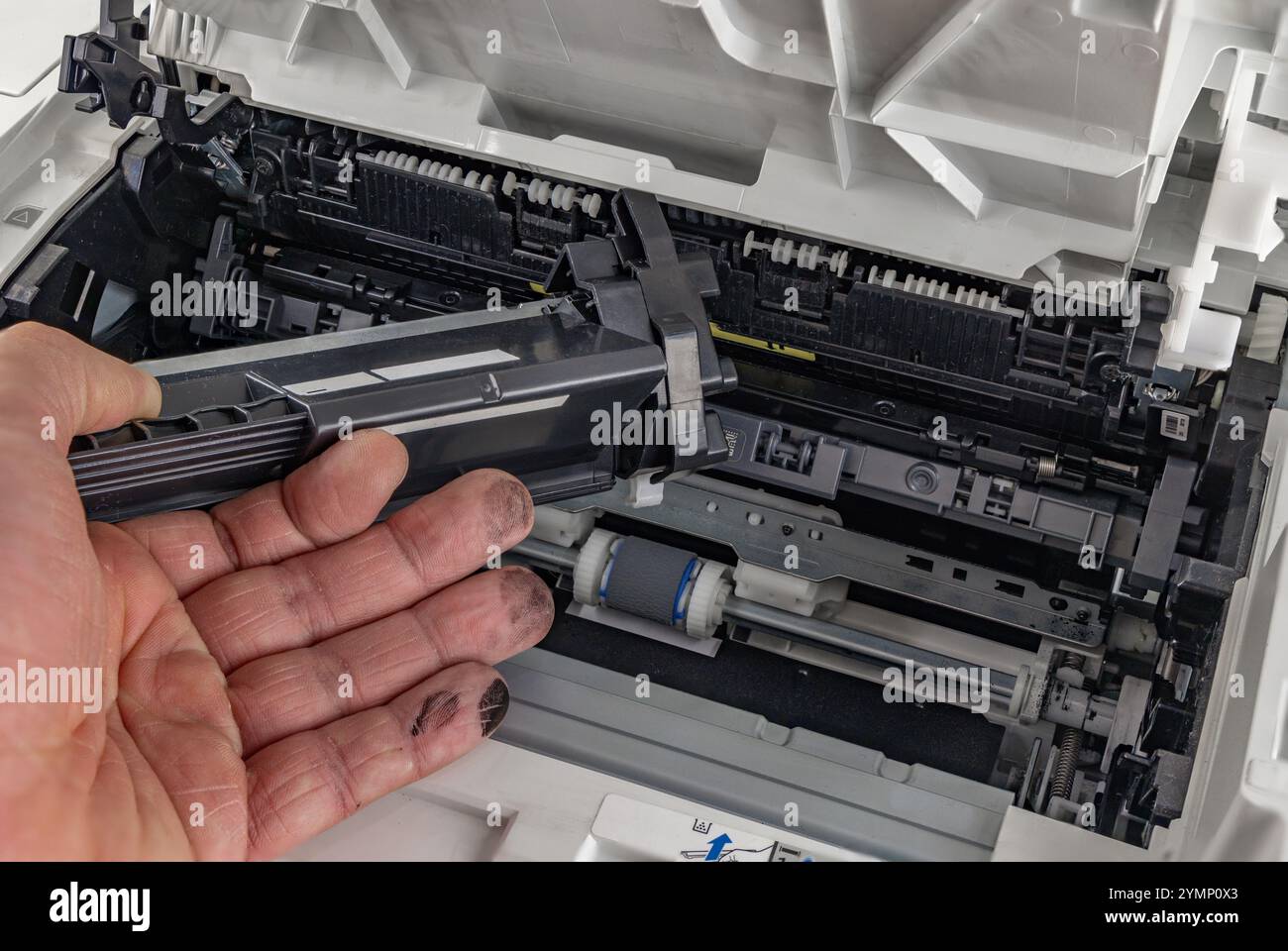 Removing a used ink cartridge from a printer in the office Stock Photo ...