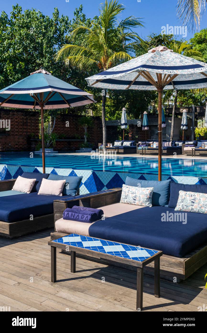 Blue deck chairs and parasols at Manarai Beach House, Sofitel, Nusa Dua ...