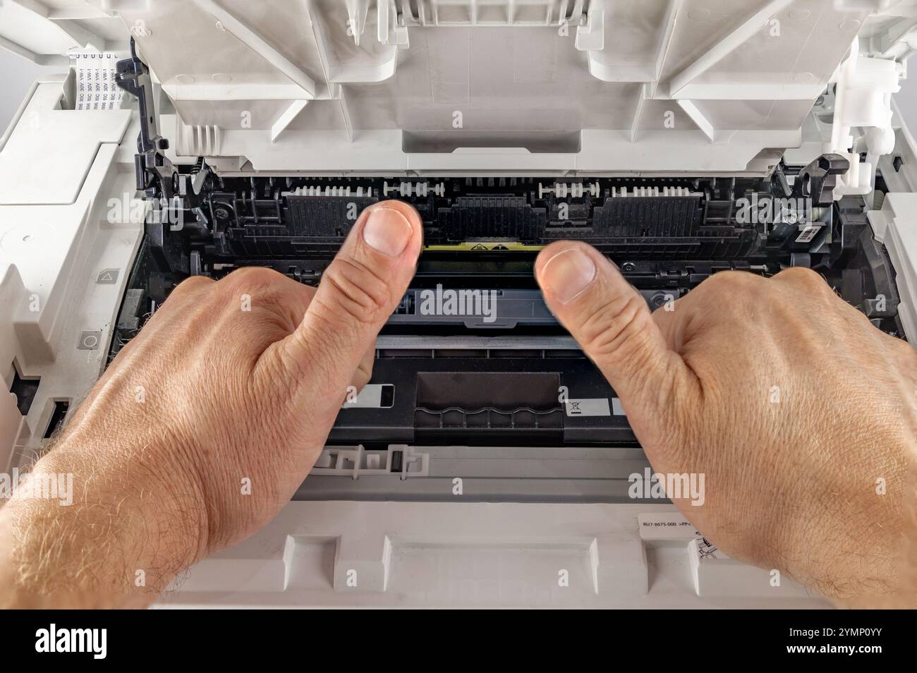 Removing a used ink cartridge from a printer in the office Stock Photo ...