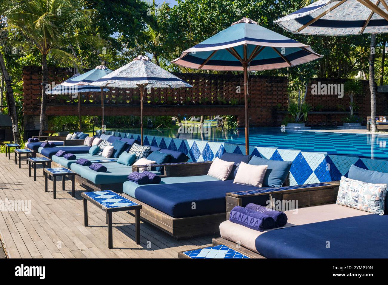 Blue deck chairs and parasols at Manarai Beach House, Sofitel, Nusa Dua ...