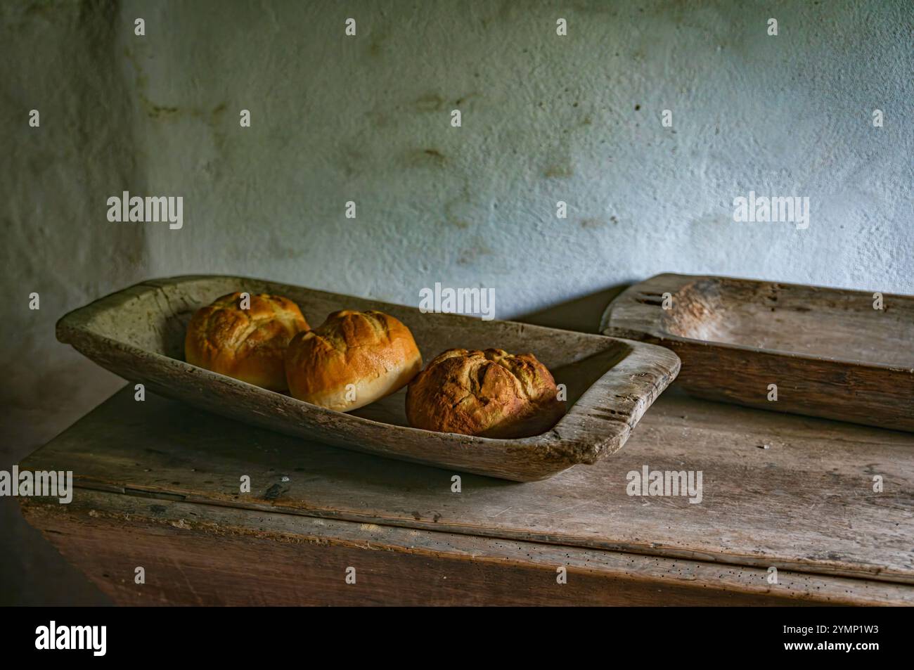 Rustic Bread Loaves in Vintage Wooden Trough Display Stock Photo - Alamy