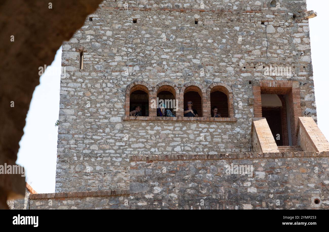 Tourists admire the view from a tower at Archaeological Museum of ...