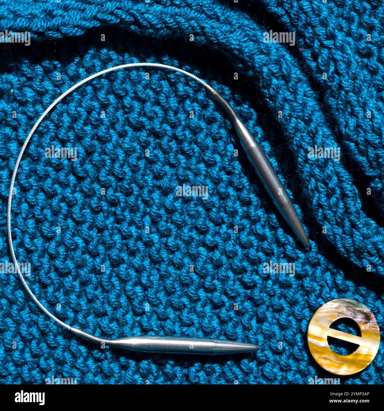 Turquoise garter stitch pattern is knitted on wool blend yarn. Handmade ...