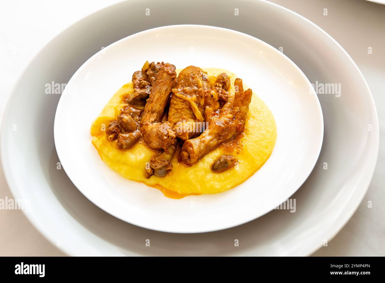 Traditional and rustic Brazilian dish, free-range chicken with polenta ...