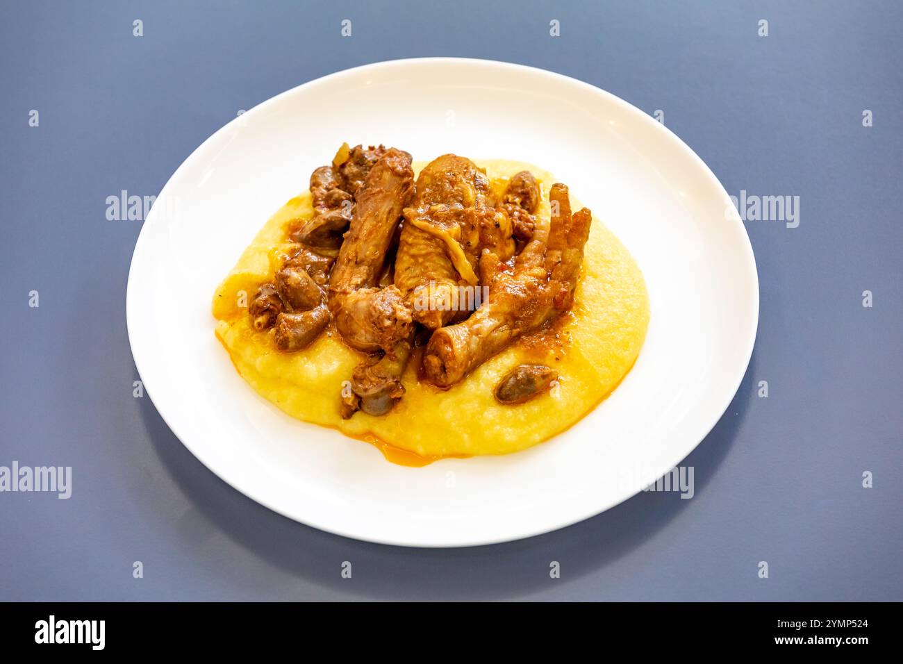 Traditional and rustic Brazilian dish, free-range chicken with polenta ...